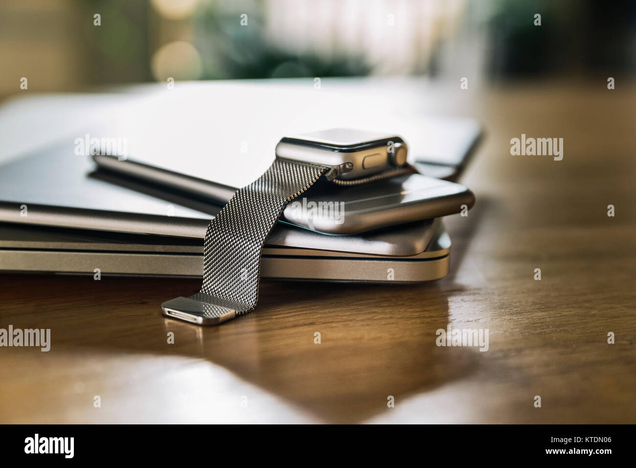Stack of mobile devices on table top Stock Photo - Alamy