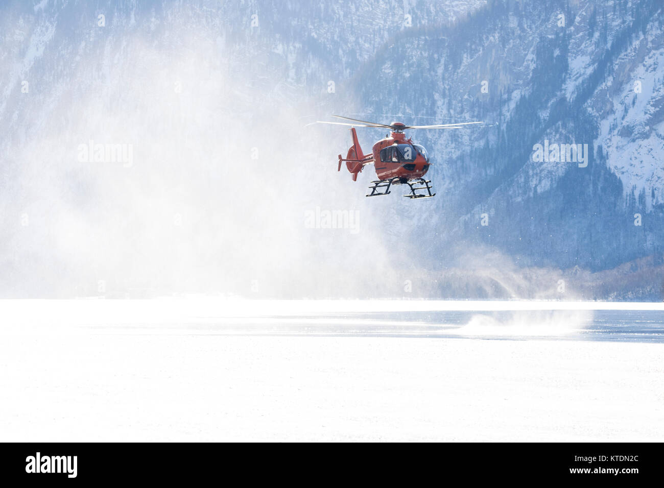 Germany, Berchtesgadener Land, flying helicopter over frozen Lake ...