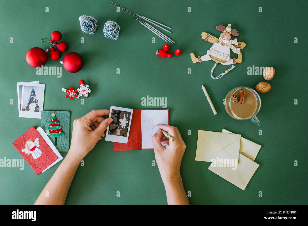 Woman's hands writing Christmas card Stock Photo - Alamy