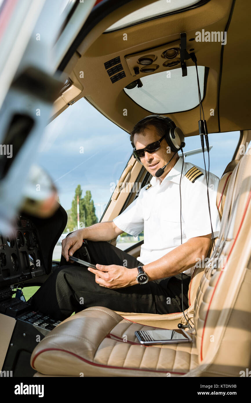 Portrait of pilot in cockpit of a helicopter Stock Photo - Alamy