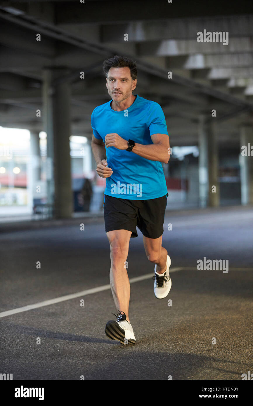 Man running in the city Stock Photo - Alamy