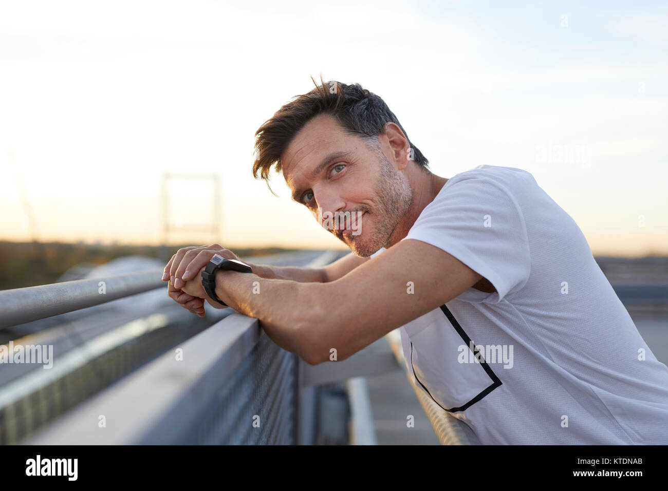 Athlete resting on railing hi-res stock photography and images - Alamy