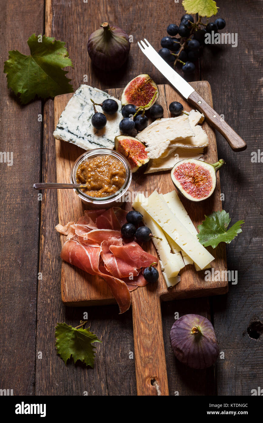 Cheese platter with fruits and fig mustard Stock Photo - Alamy