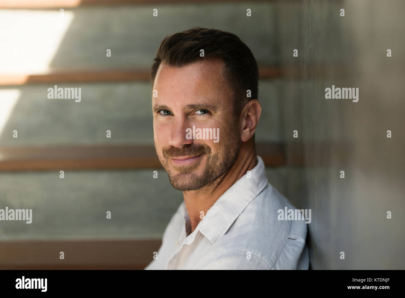 Attractive man smiling, portrait Stock Photo - Alamy
