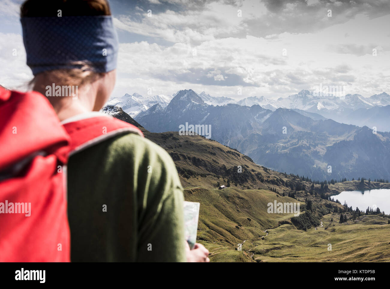 Germany, Bavaria, Oberstdorf, hiker with map in alpine scenery Stock ...