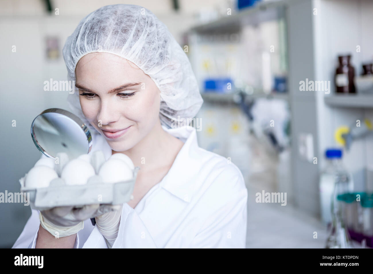 Scientist in lab examining eggs Stock Photo - Alamy