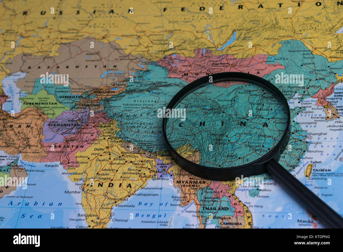 Map of china through magnifying glass on a world map Stock Photo - Alamy