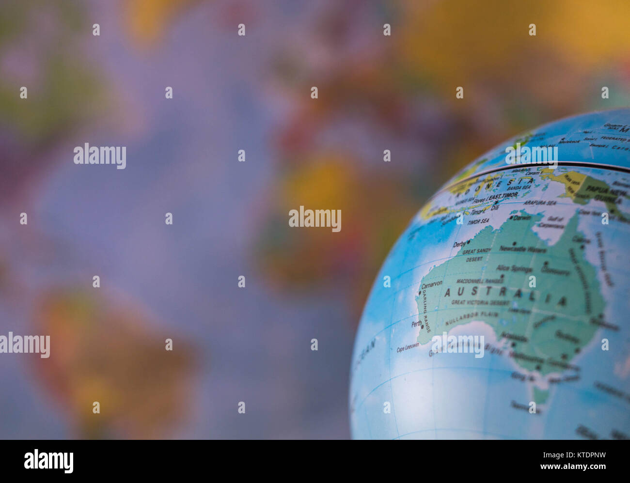 Australia map on a globe with earth map in the background Stock Photo ...