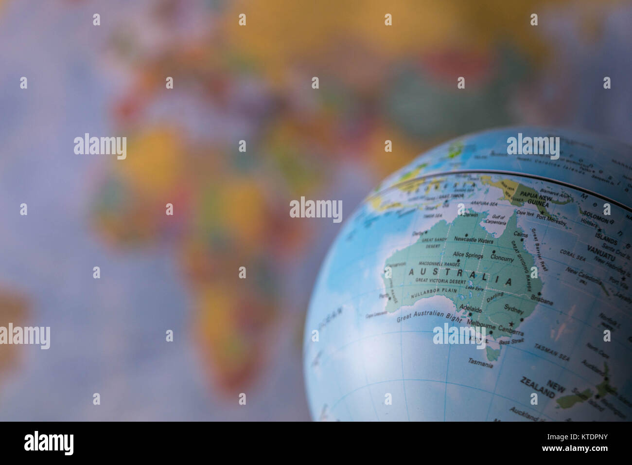Australia map on a globe with earth map in the background Stock Photo ...