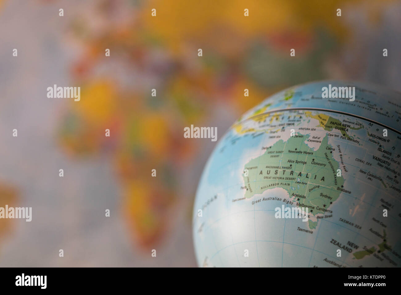Australia map on a globe with earth map in the background Stock Photo ...
