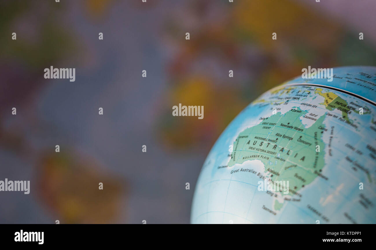 Australia map on a globe with earth map in the background Stock Photo ...