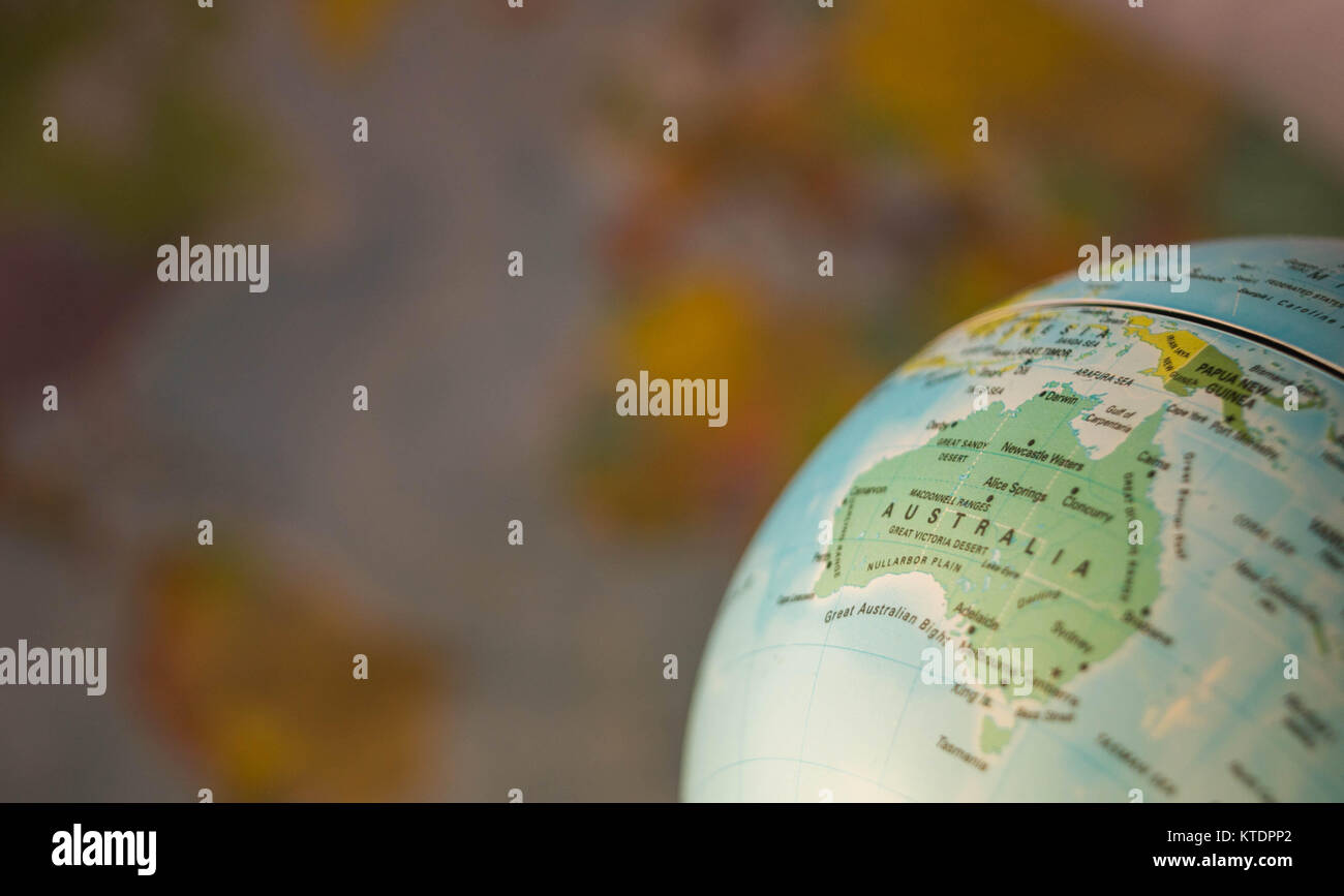 Australia map on a globe with earth map in the background Stock Photo ...