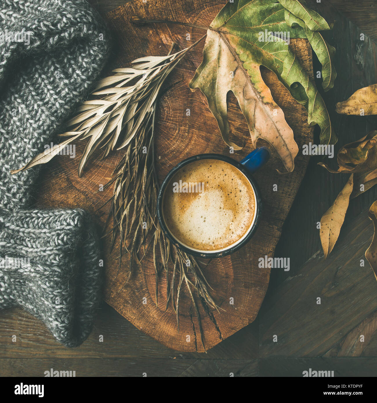 Autumn morning coffee concept with leaves and sweater, square crop ...