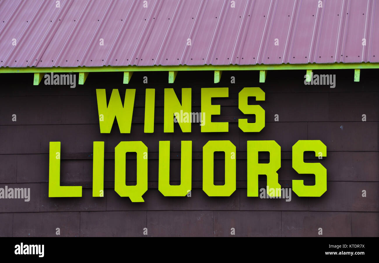 Wines and Liquors sign on the side of a small town liquor store ...