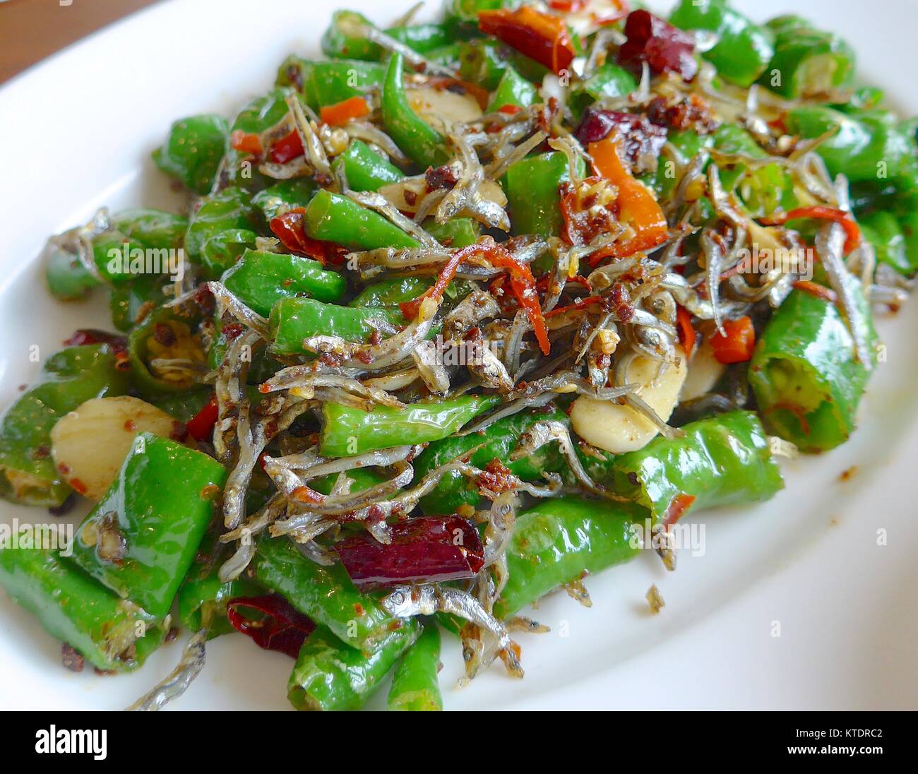 Fried dry fish with pepper closeup Stock Photo - Alamy