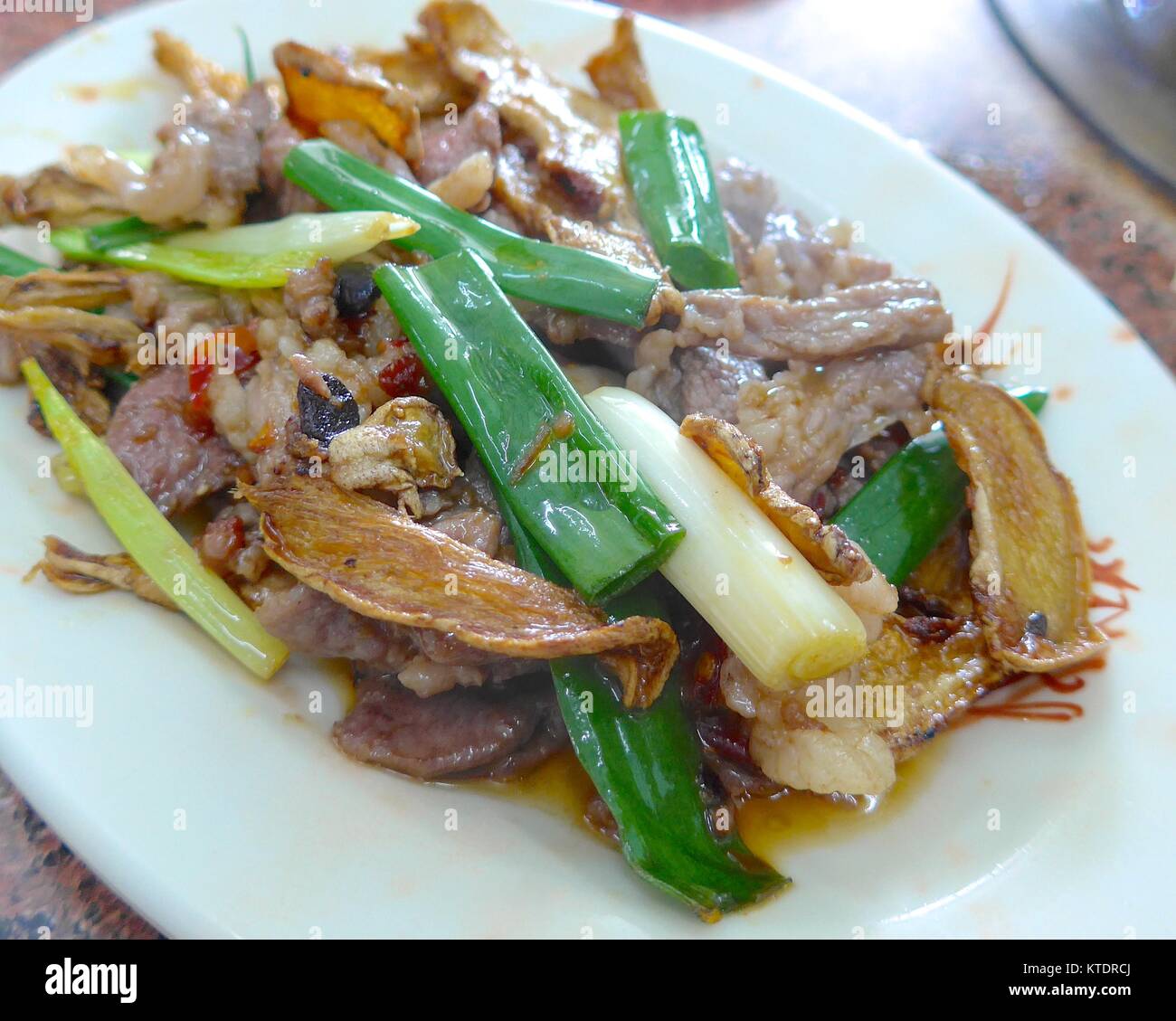 Quick-fried lamb with sesame oil Stock Photo - Alamy