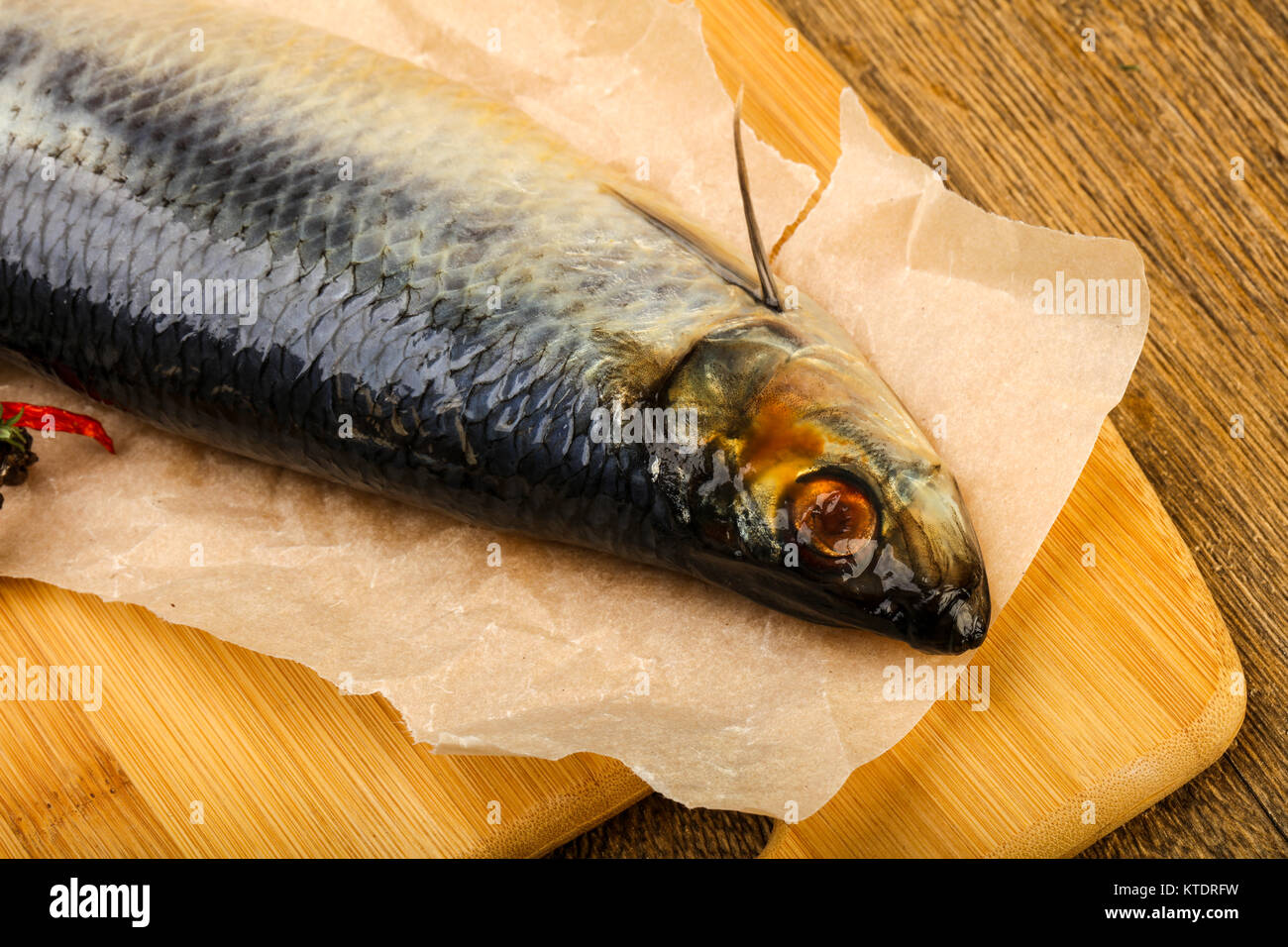 Salted Herring fish with pepper and spices Stock Photo - Alamy