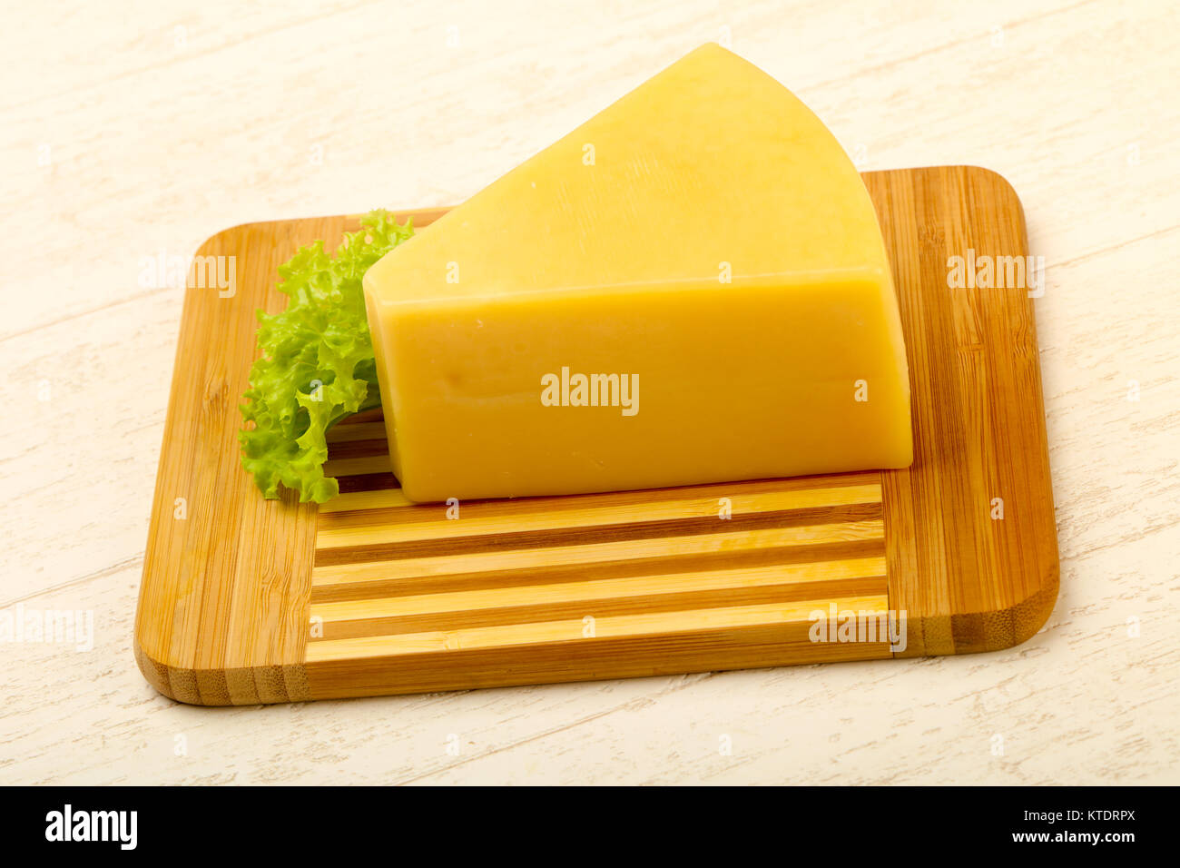 Parmesan cheese triangle Stock Photo - Alamy