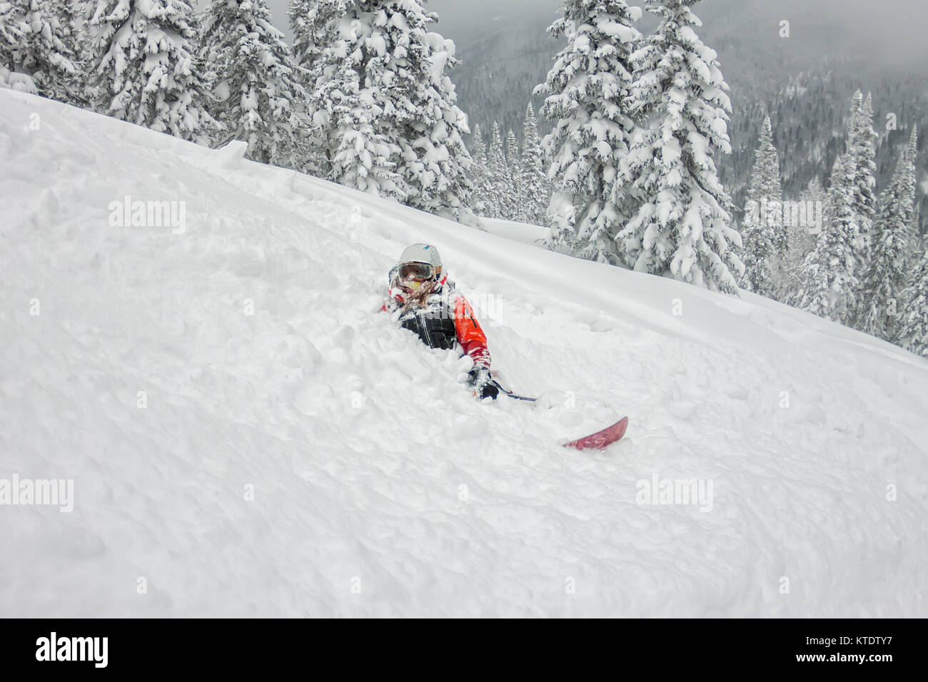 Skier freerider jumping from a snow ramp in the sun on a background of ...