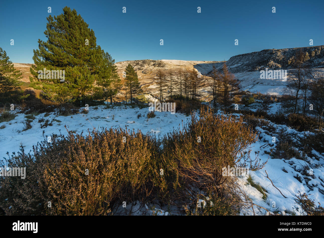 Rocks, trees, snow and blue sky at Binn Green, Greenfield, Saddleworth ...