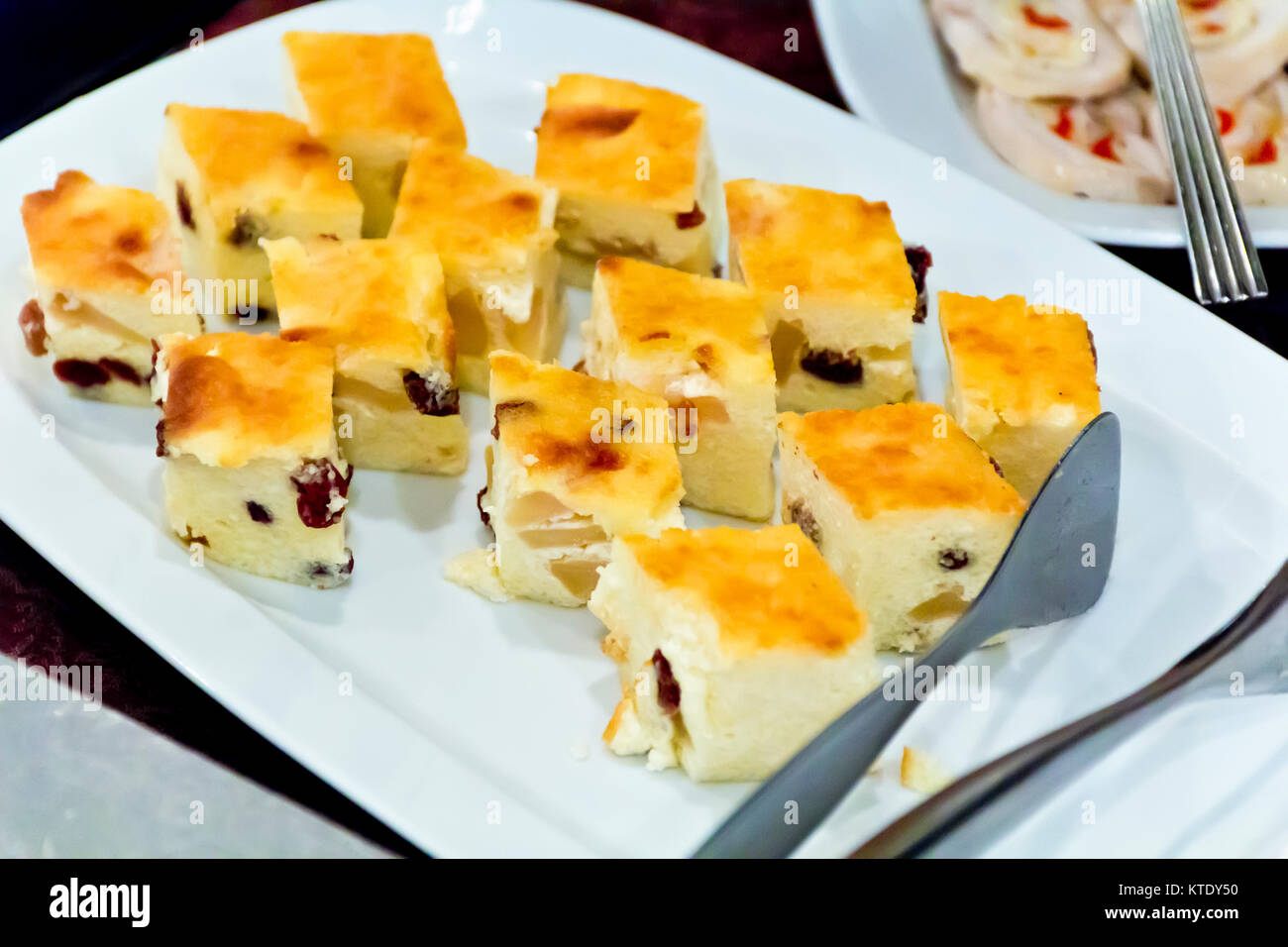 Horizontal photo of cottage cheese dishes in restaurant with spoon ...