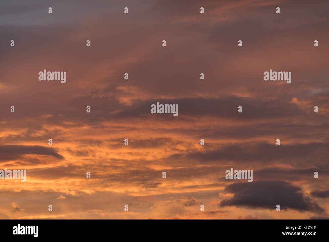 Dramatic fiery sunset with orange and red clouds Stock Photo - Alamy
