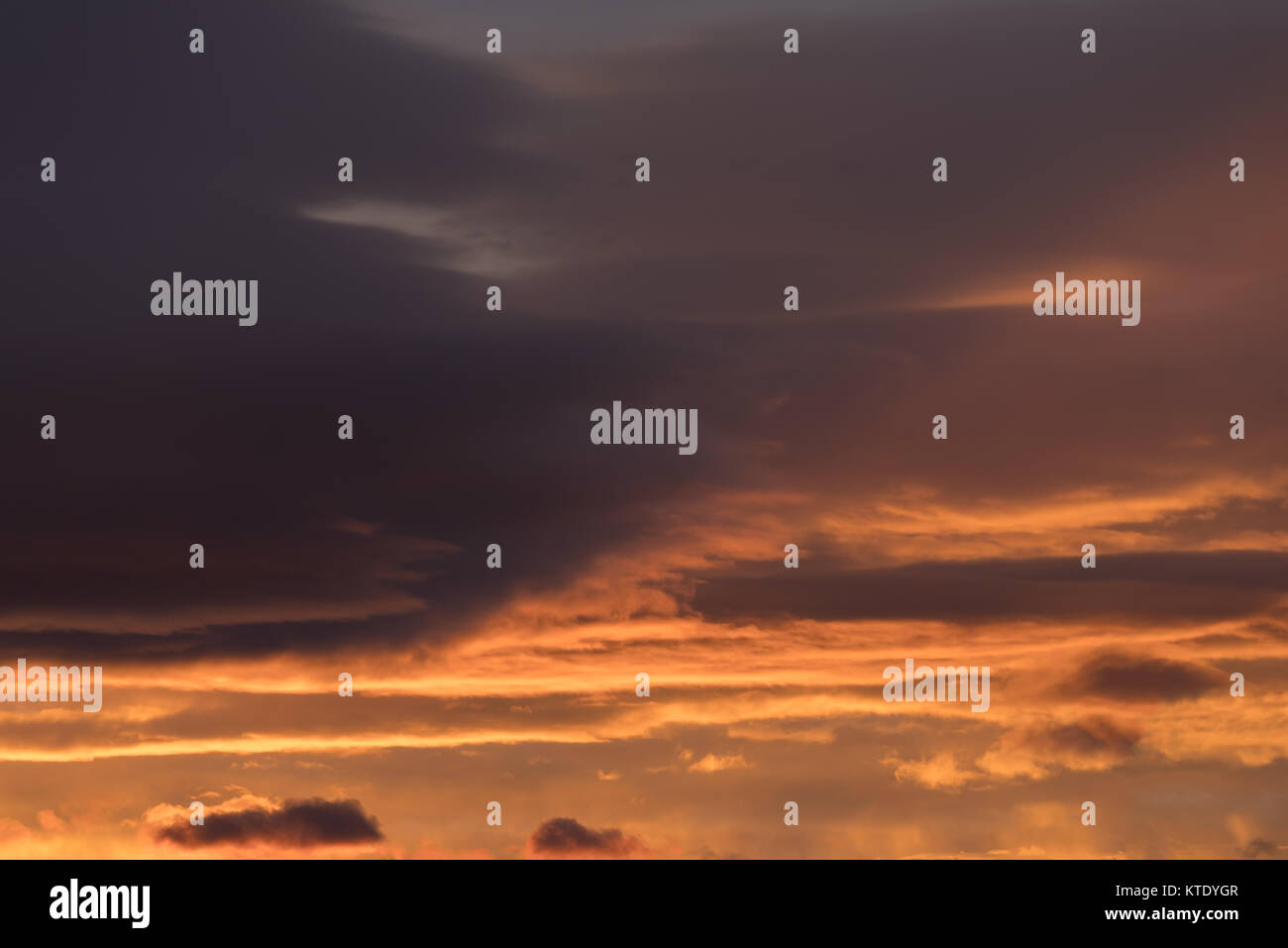 Dramatic fiery sunset with orange and red clouds Stock Photo - Alamy