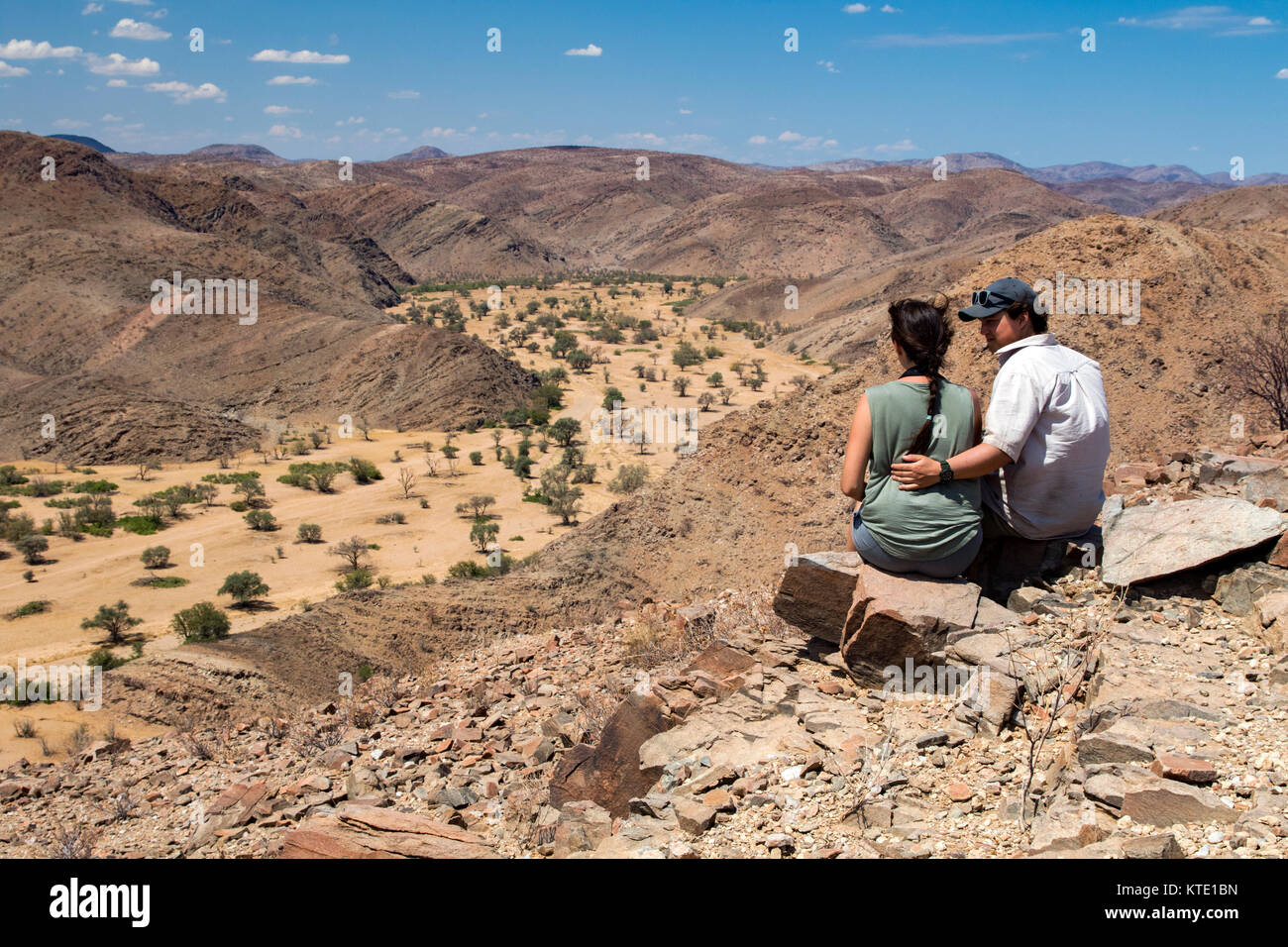 Couple overlooking Huab River in Damaraland - Huab Under Canvas ...