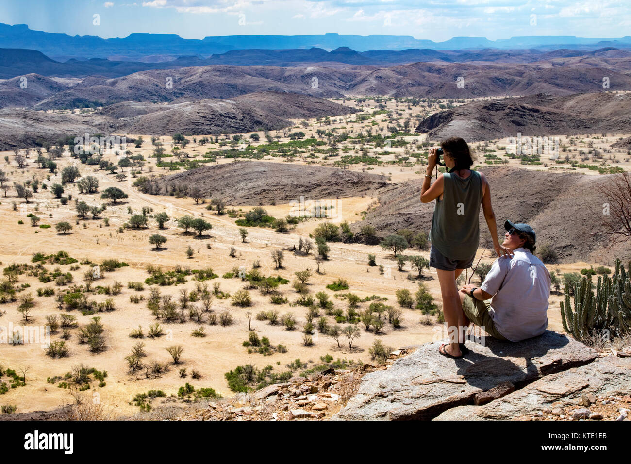 Couple overlooking Huab River in Damaraland - Huab Under Canvas ...