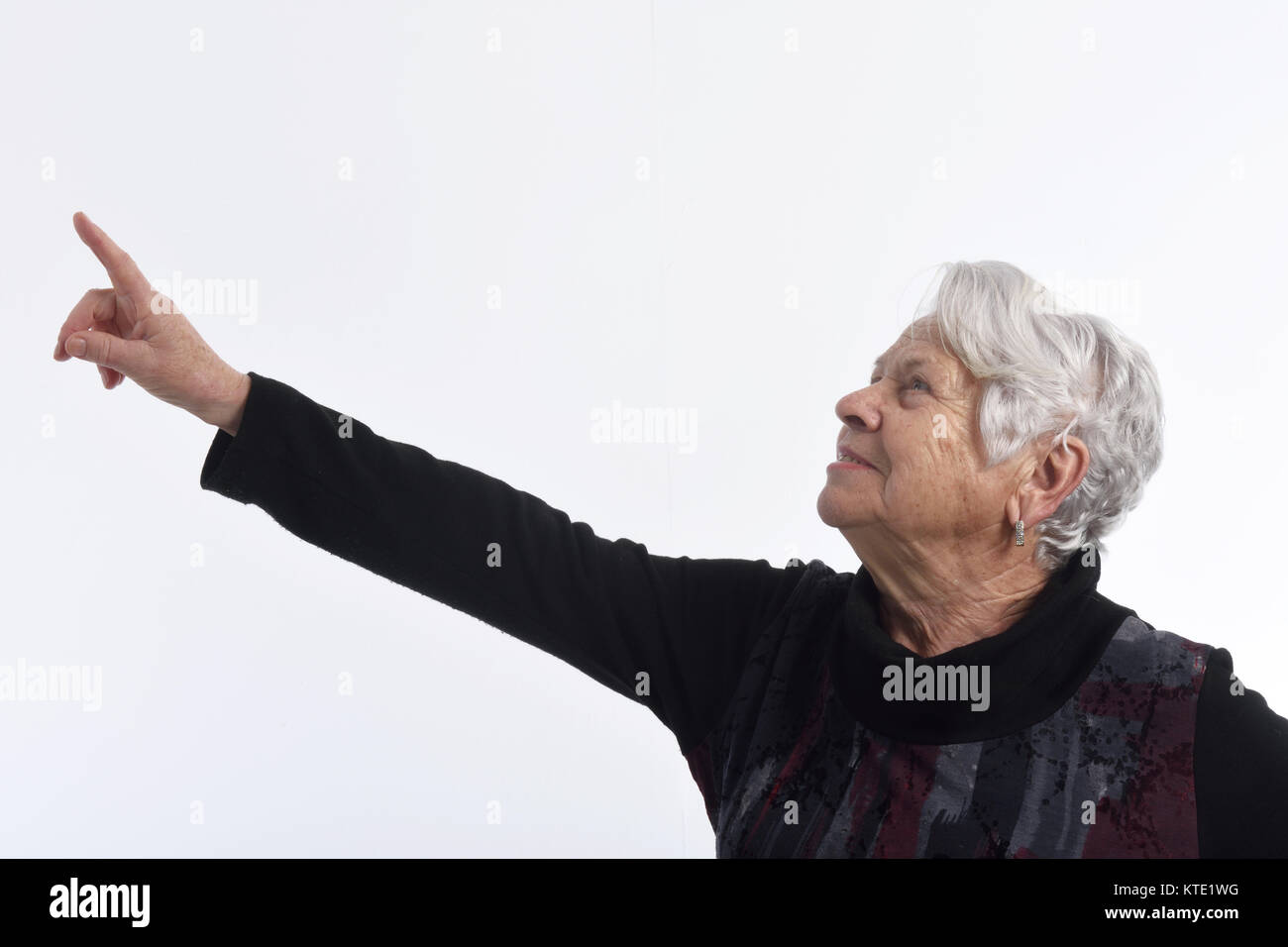 Elderly woman pointing Stock Photo - Alamy