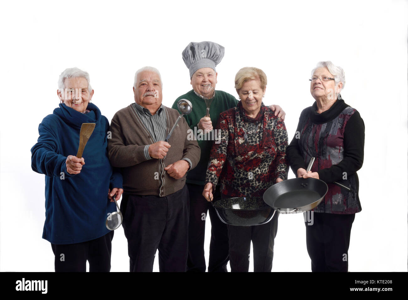 Young woman cooking for an elderly man hi-res stock photography and ...