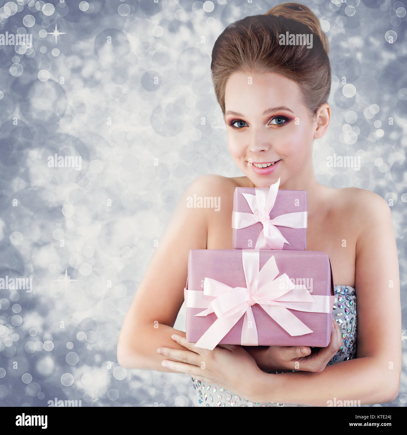 Beautiful Woman Fashion Model with Gifts on Glitter Party Background ...