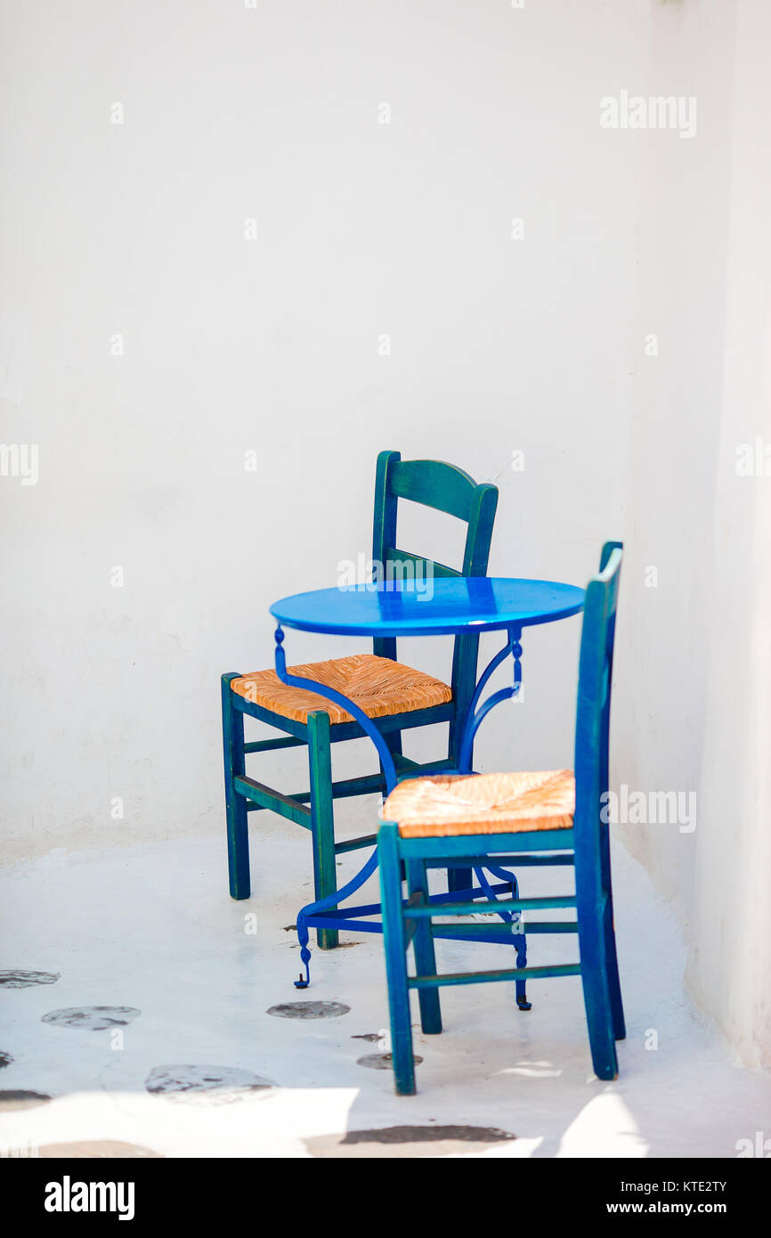 Outdoor cafe on the street of typical greek traditional village on ...