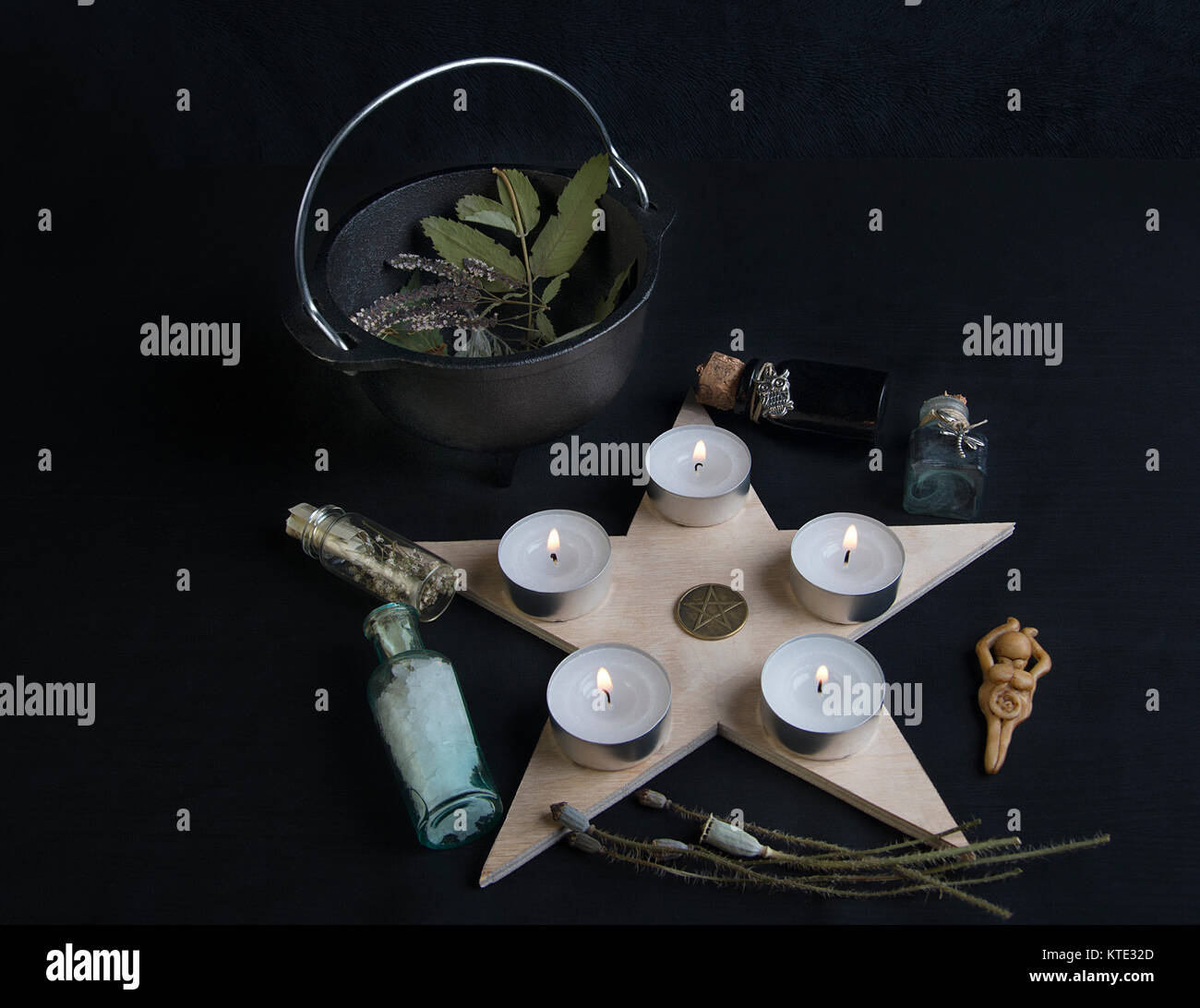 Wiccan altar with cauldron, pentacle and ingredients Stock Photo - Alamy
