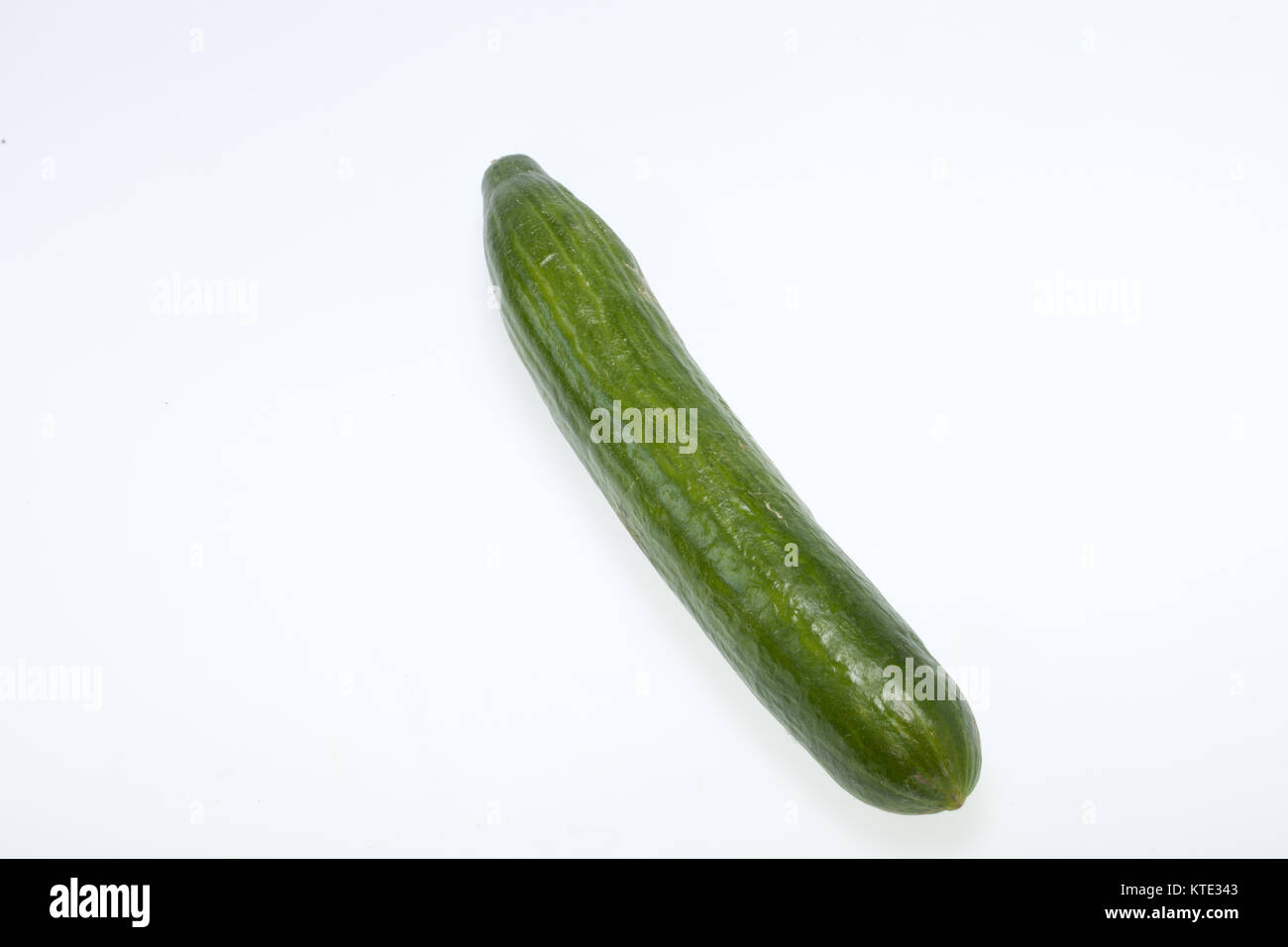 The green cucumber isolated on white background Stock Photo - Alamy