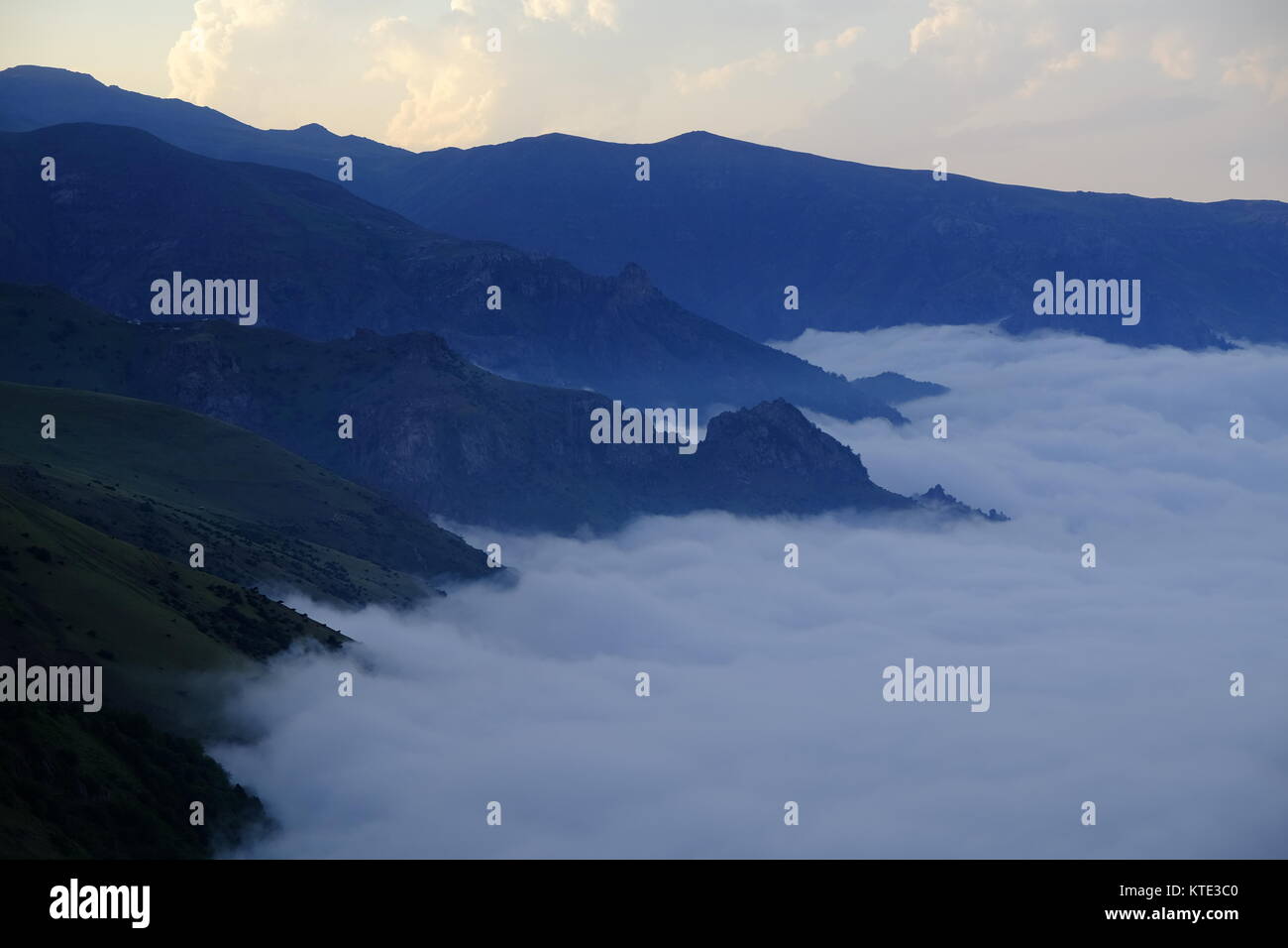 Sea of clouds at Subatan under the mountain ridges of the northern ...