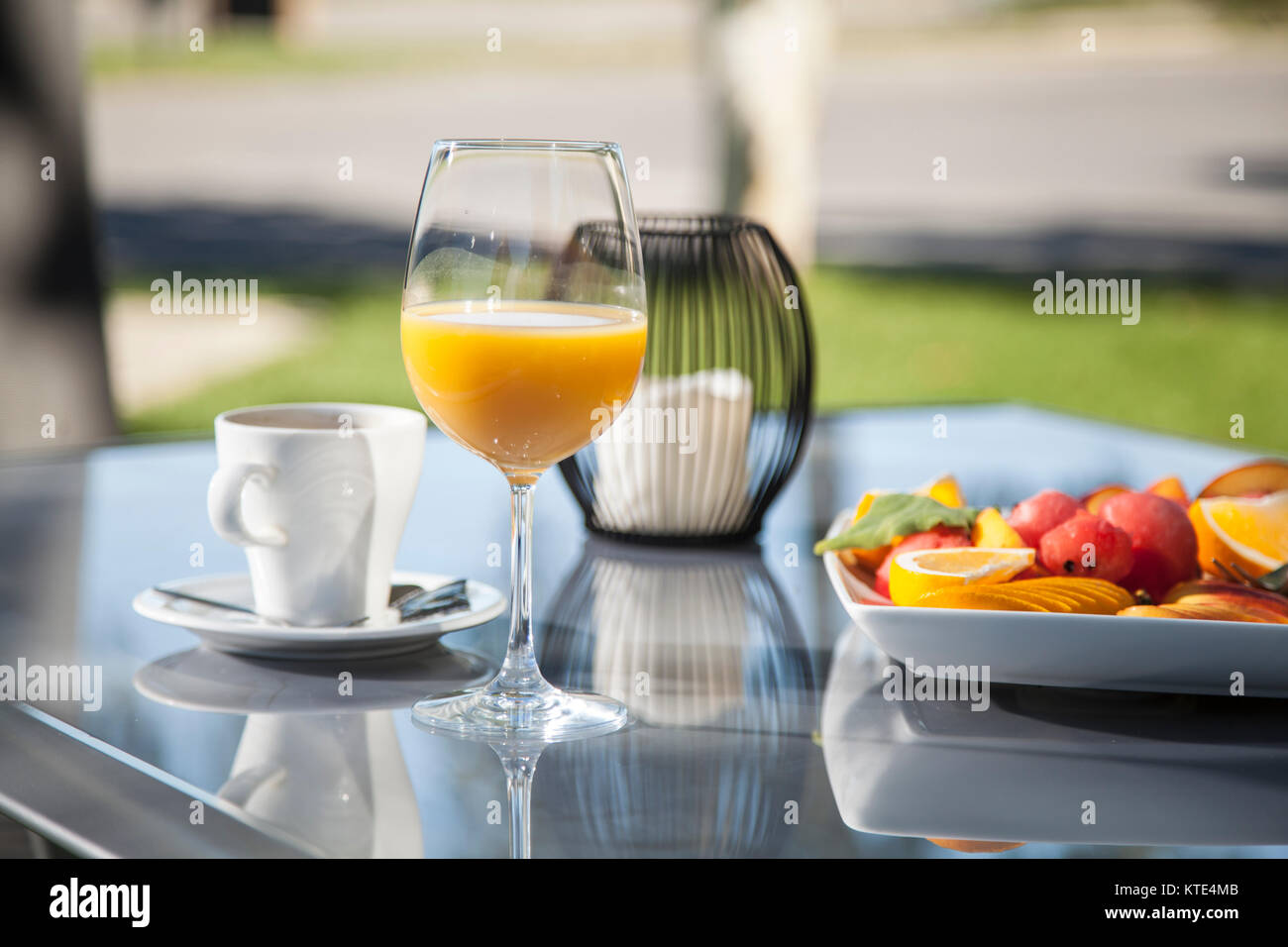 outside breakfast with fruit salad and orange juice Stock Photo - Alamy