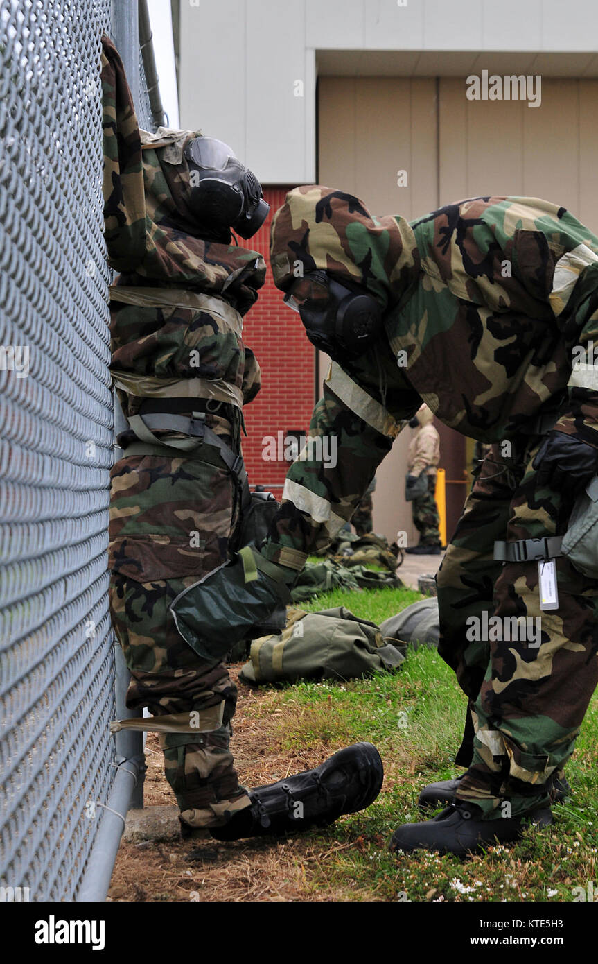 An Airman, assigned to the 178th Wing, pats down a dummy during a ...
