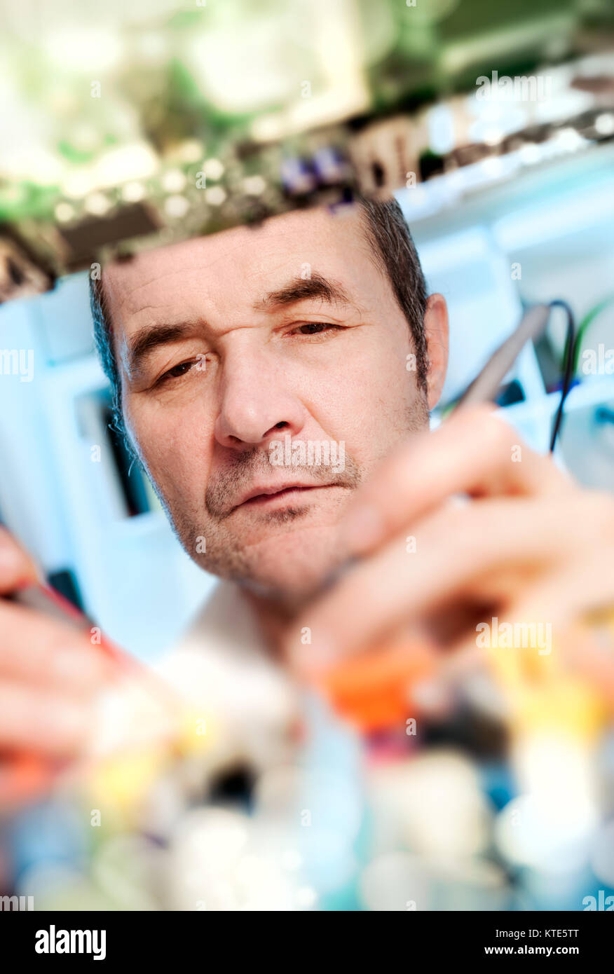 Senior repair tech tests hi-res stock photography and images - Alamy