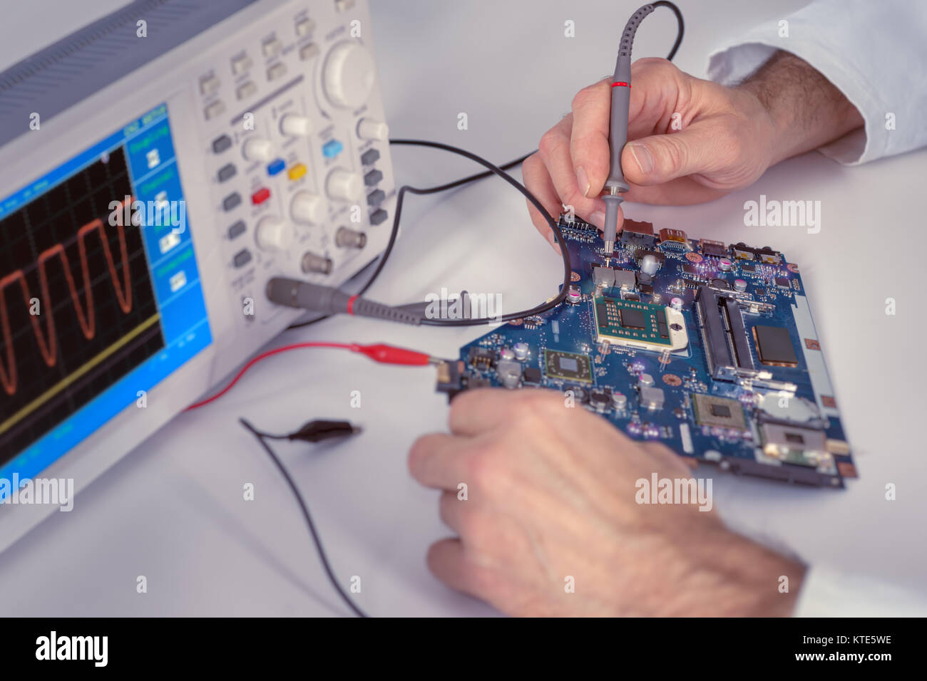 Technological background with closeup on tester checking motherboard ...