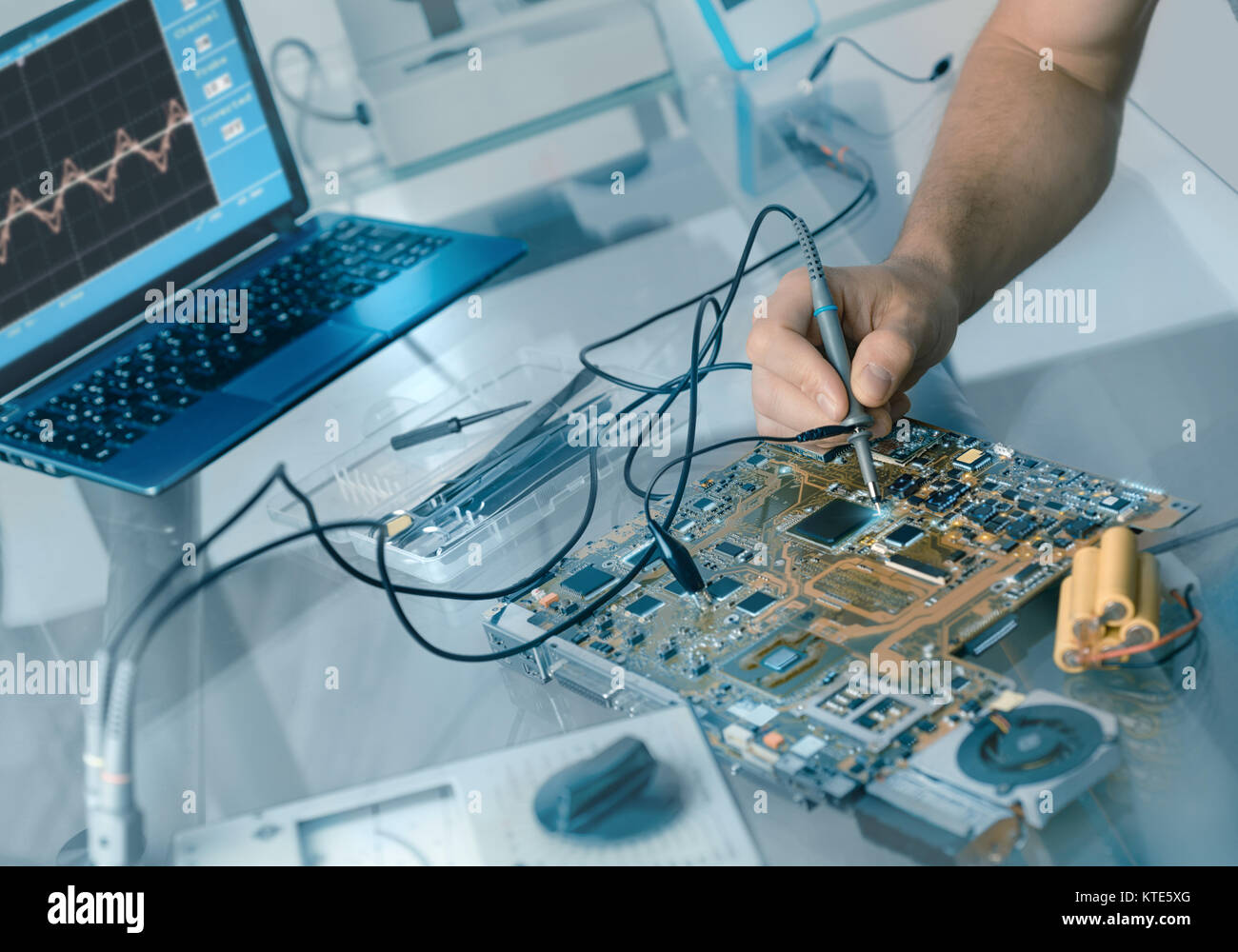 Electronics Repair Background Hand Of Male Tech Testing Motherboard