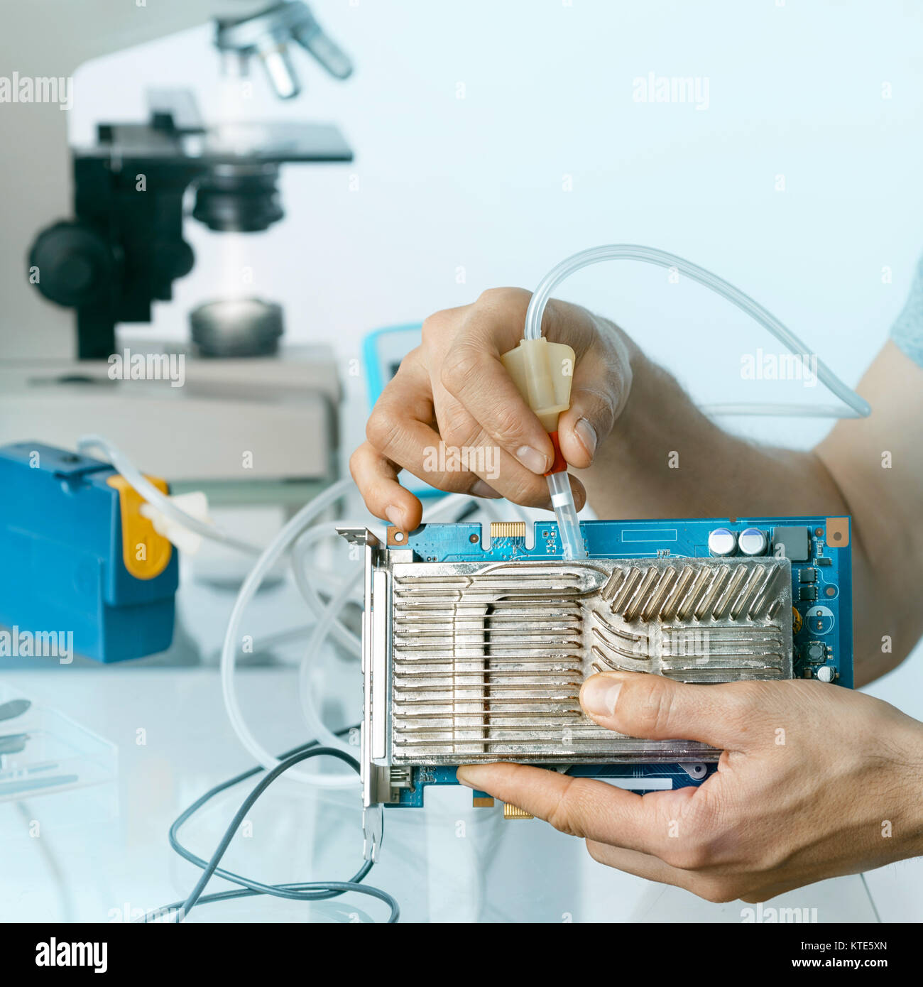 Mle teach hoovers a cooler in computer hardware repair workshop Stock ...