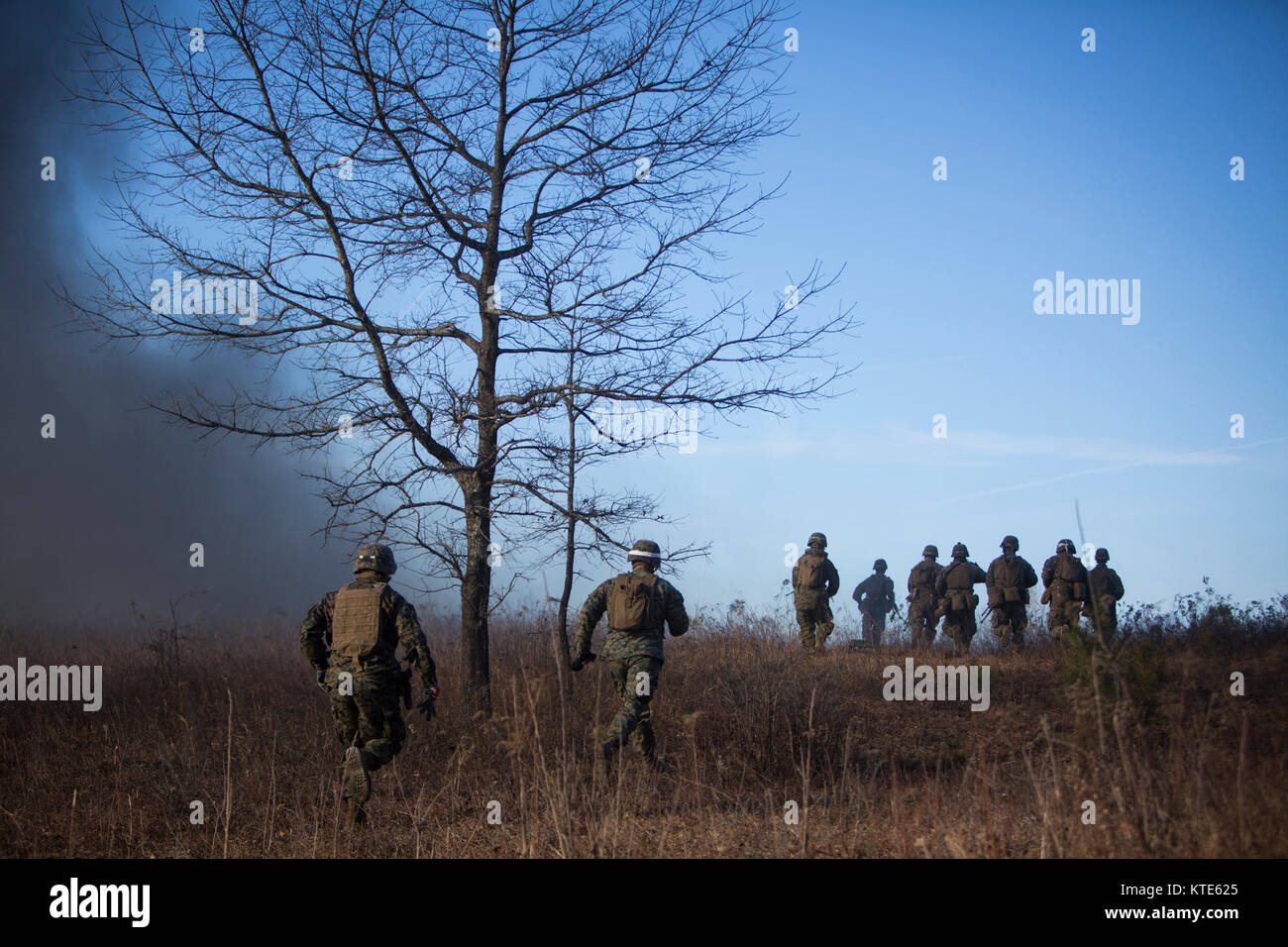 U.S. Marines with Company G., 2nd Battalion, 8th Marine Regiment, cross ...