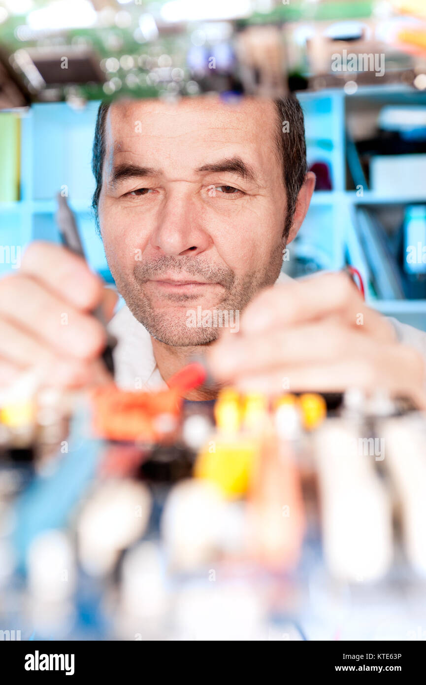 Senior repair tech tests hi-res stock photography and images - Alamy