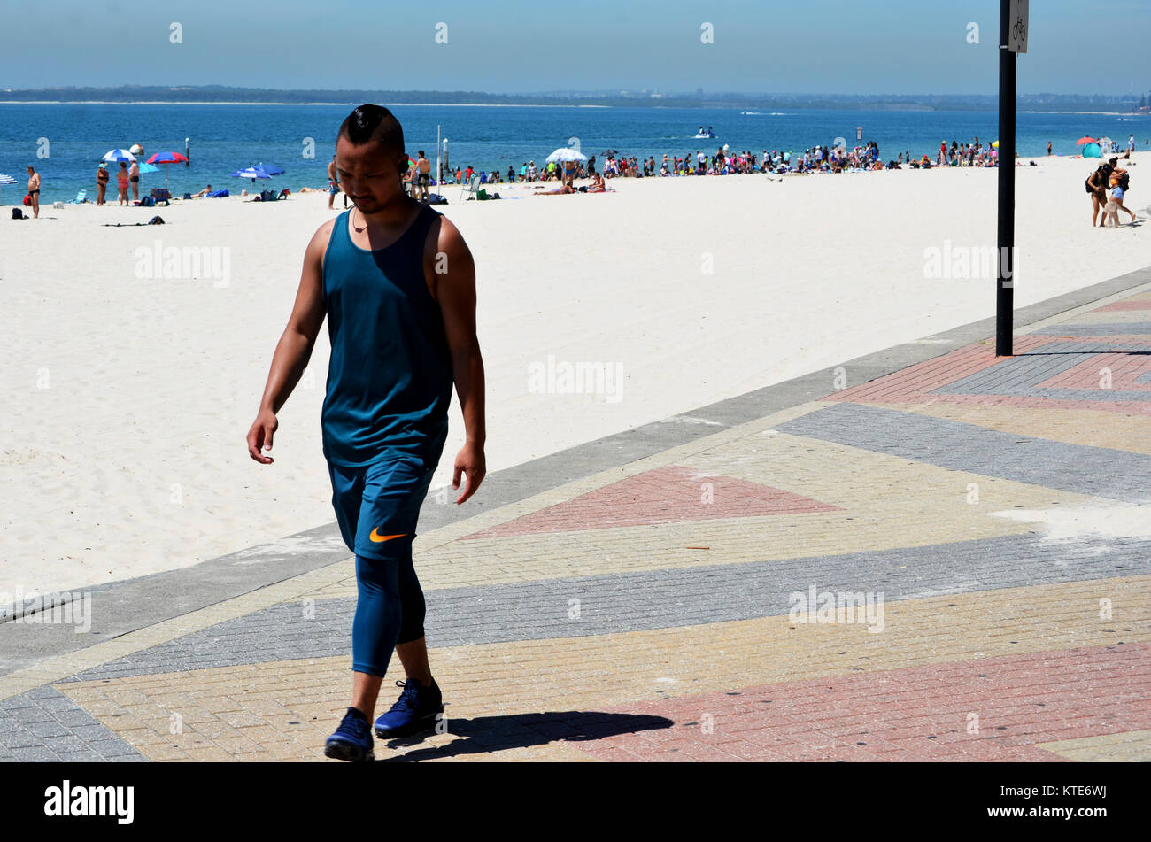 Man walking along beach in fitness clothing Stock Photo - Alamy Man walking along beach in fitness clothing Stock Photo - Alamy