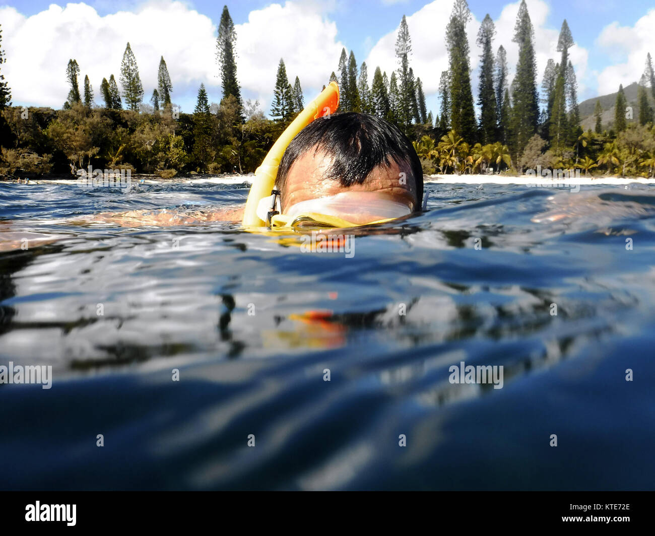 Man snorkeling half submerged Stock Photo - Alamy