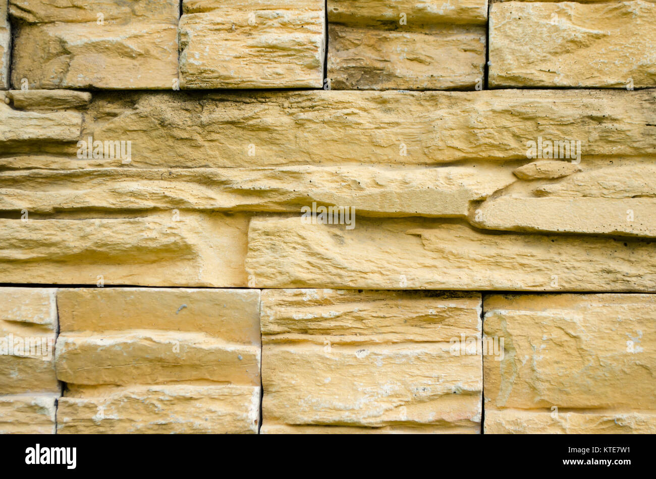 Background of yellow brick stone wall. Studio Photo Stock Photo - Alamy