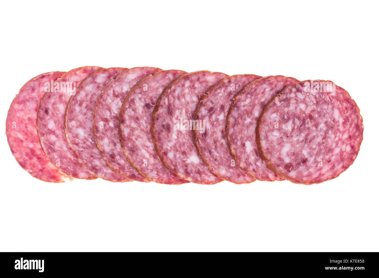 Sliced salami on light background. Studio Photo Stock Photo - Alamy