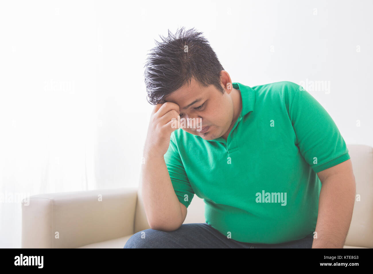 overweight man depress thinking about his weight problem Stock Photo ...
