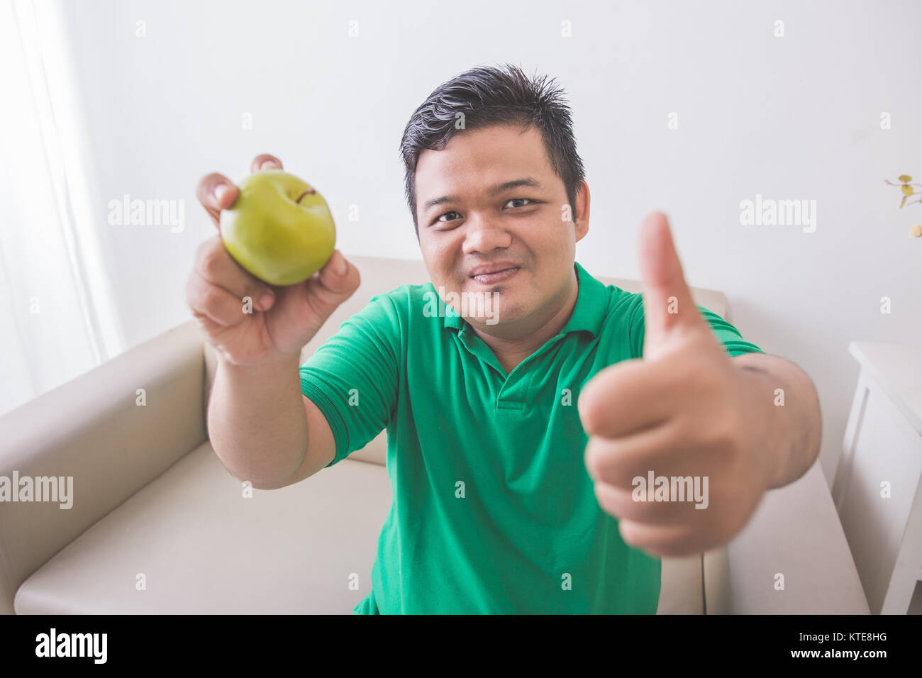 man trying to eat healthy fresh food Stock Photo - Alamy
